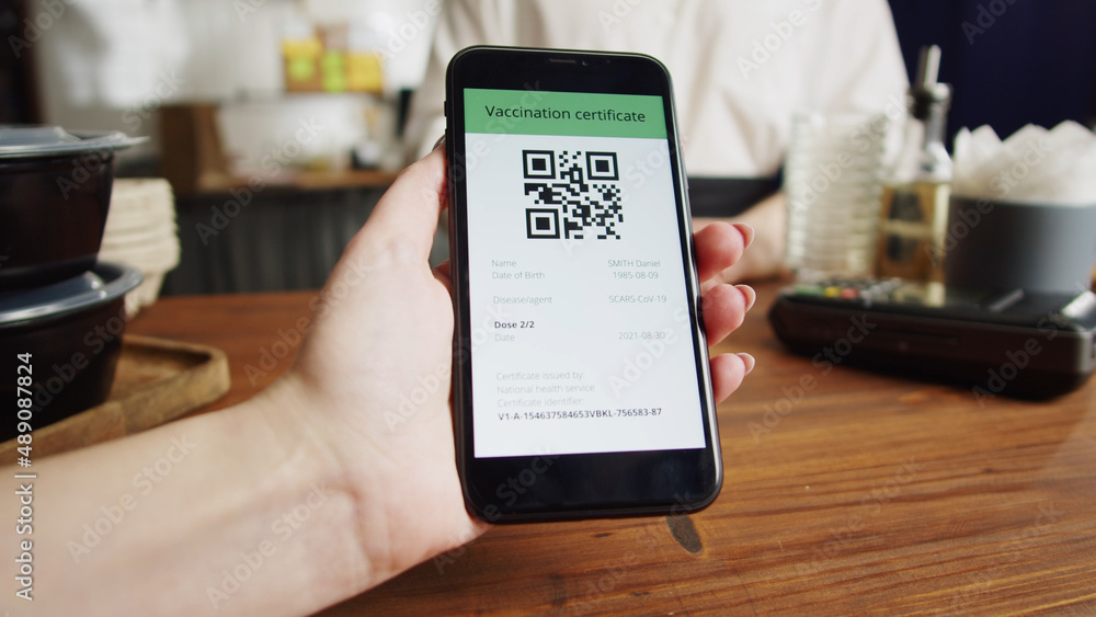 QR code, covid vaccination passport control close-up. Scanning ...