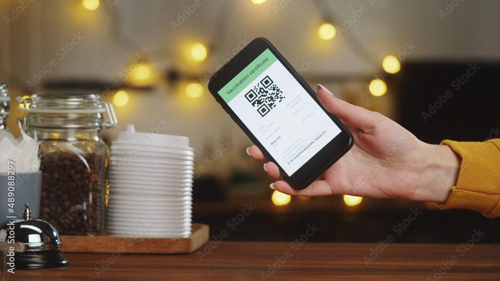 QR code, covid vaccination passport control close-up. Scanning ...