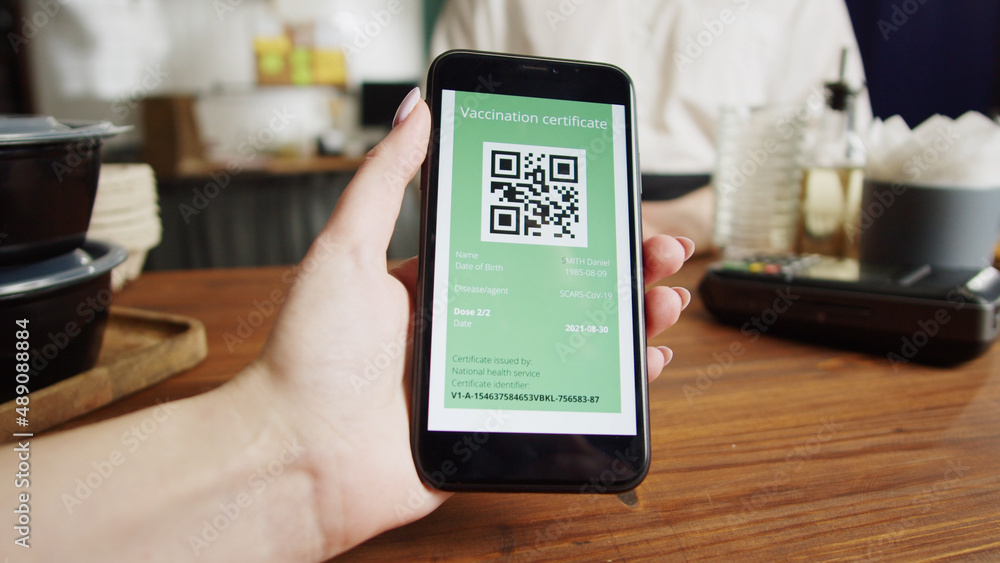 QR code, covid vaccination passport control close-up. Scanning ...