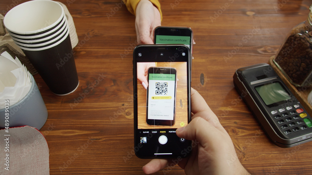 QR code, covid vaccination passport control close-up. Scanning ...