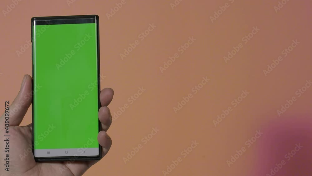 Smartphone screen. Smart phone isolated on color background. Green ...