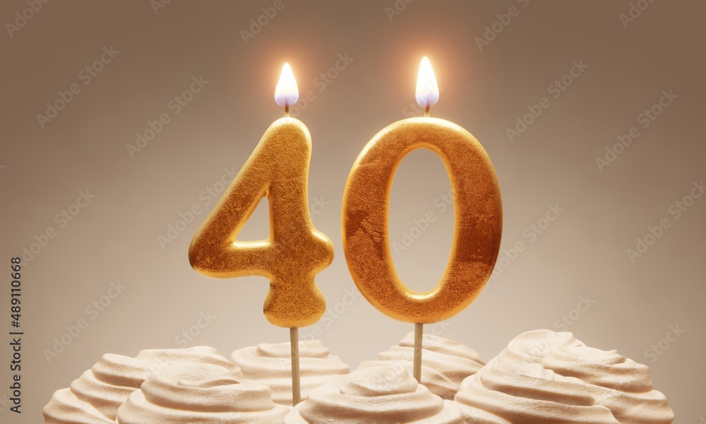 40th birthday or anniversary celebration. Lit golden number candles on ...