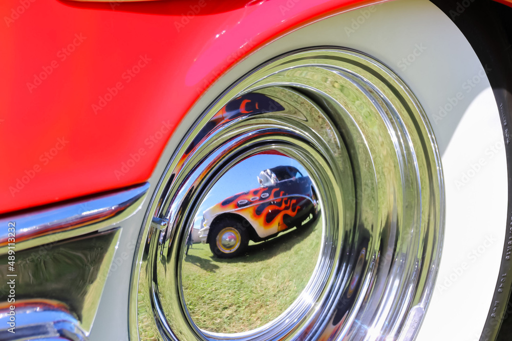 reflection of hot rod in classic car hubcap Stock Photo | Adobe Stock