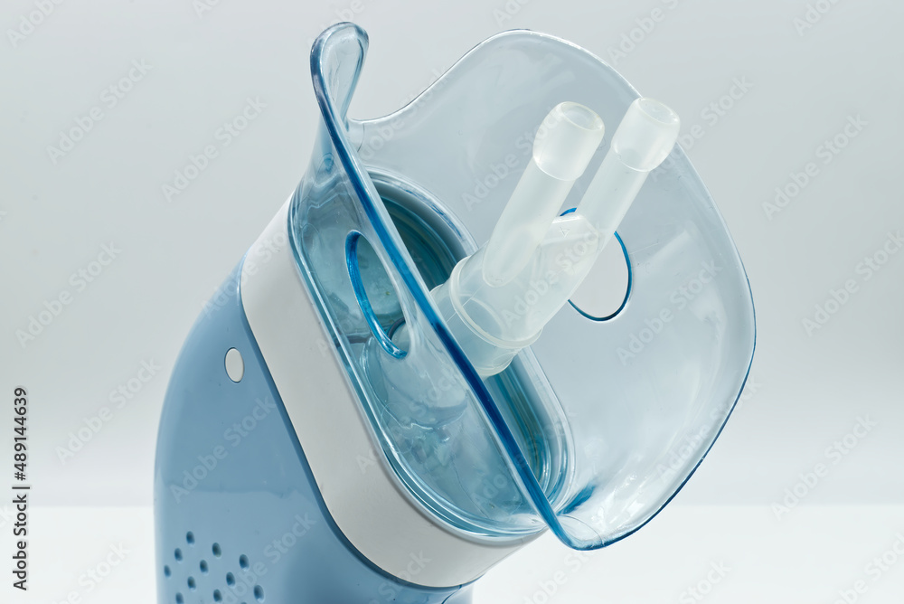 Portable compressor nebulizer with inhaler tool. Close-up. Medical ...