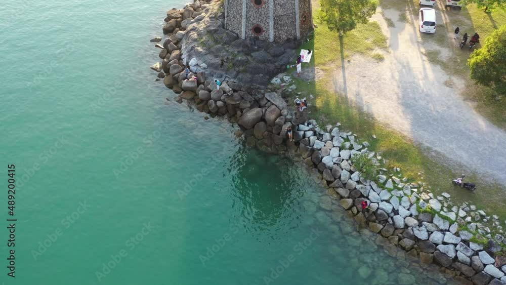 Birds eye view drone flyover perdana quay light house, reveals ...