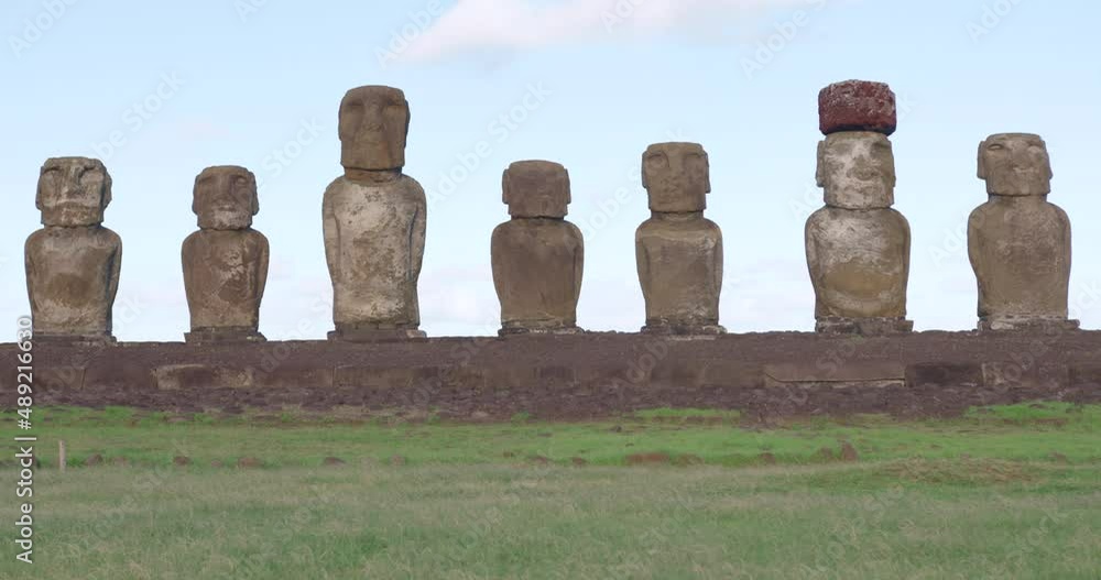 Ancient moai stand looking west, worshipping the sun god Kon Tiki on ...