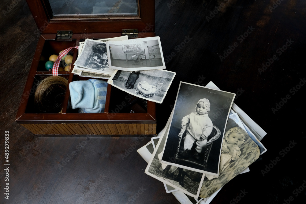 old wooden box, a stack of retro photos on natural wood background ...