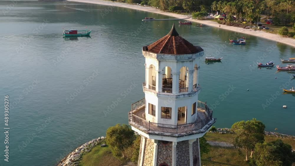 Cinematic orbiting shot drone fly around tourist landmark perdana quay ...