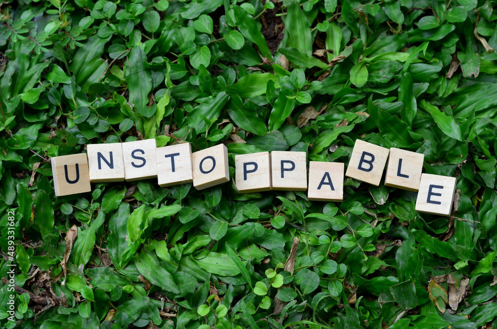 unstoppable text on wooden square, motivation and business quotes Stock ...