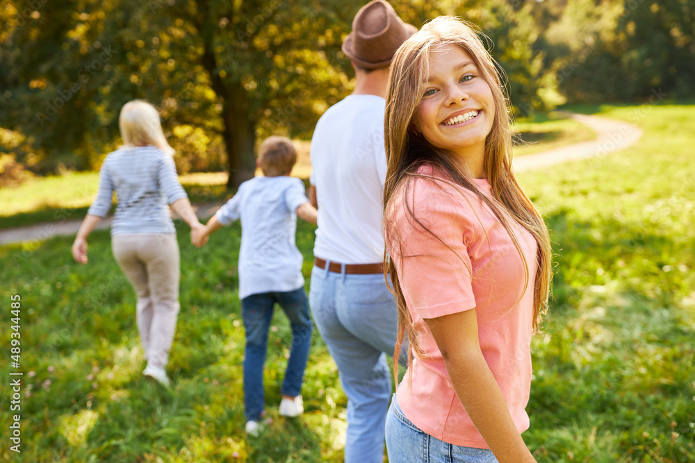 Teenagers with family in the park on an outing Stock Photo | Adobe Stock