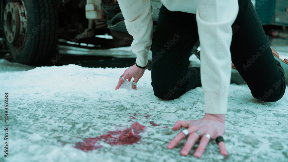Close Up Shot of a Puked Out Blood on The Snow As a Young Female ...