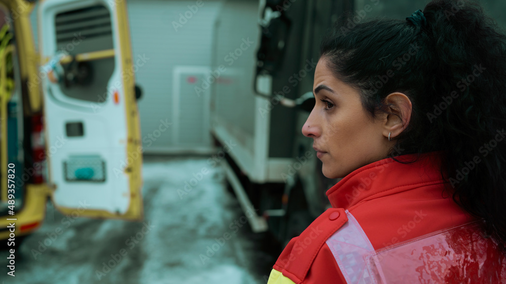 Side View of a Young Ethnic Medic Standing Next to The Ambulance Car ...