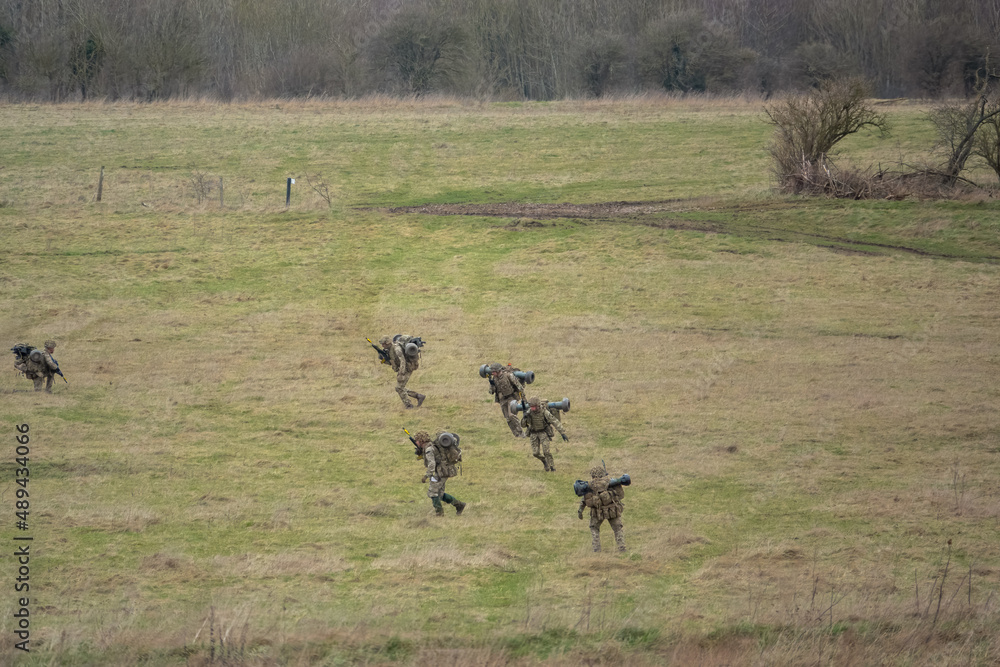 army soldiers on a military tabbing exercise with 40Kg bergen and anti ...