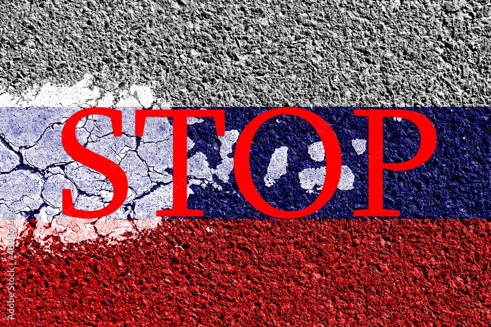 flag of the Russian Federation on a cracked concrete asphalt with the ...