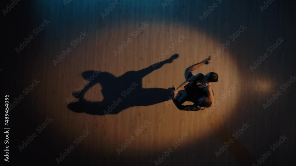 Top view of a couple of ballroom dancers dancing Argentine tango ...