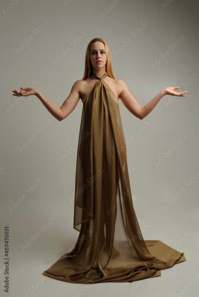Full length portrait of pretty female model wearing grecian goddess ...