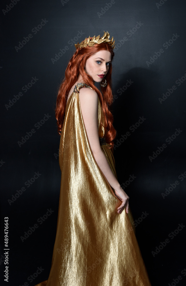 Full length portrait of pretty female model wearing grecian goddess ...