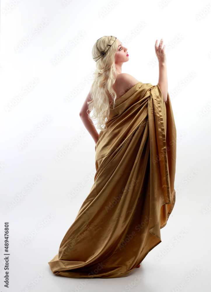 Full length portrait of pretty female model wearing grecian goddess ...