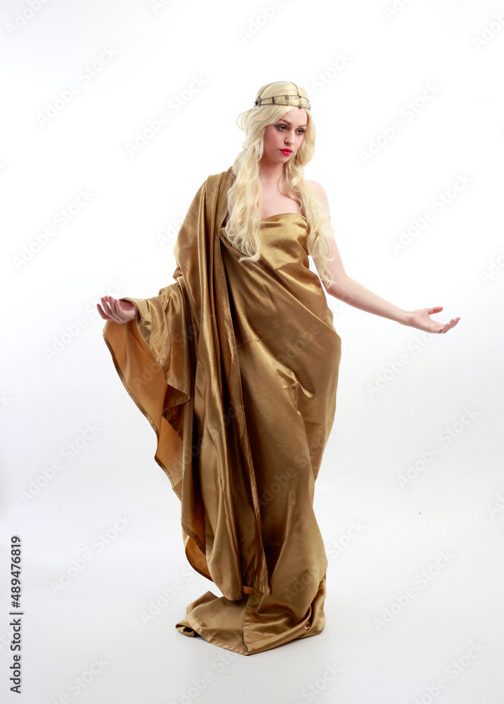 Full length portrait of pretty female model wearing grecian goddess ...