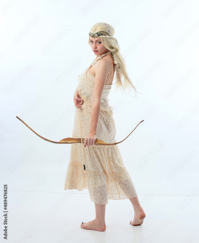 Full length portrait of pretty female model wearing grecian goddess ...