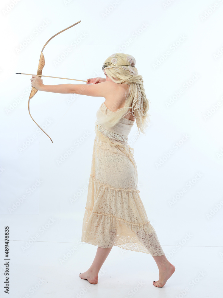 Full length portrait of pretty female model wearing grecian goddess ...