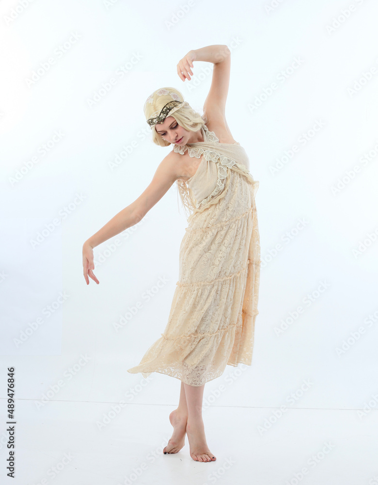 Full length portrait of pretty female model wearing grecian goddess ...