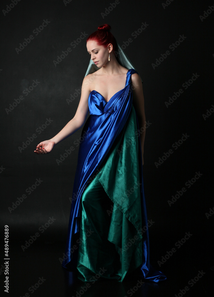 Full length portrait of pretty female model wearing grecian goddess ...