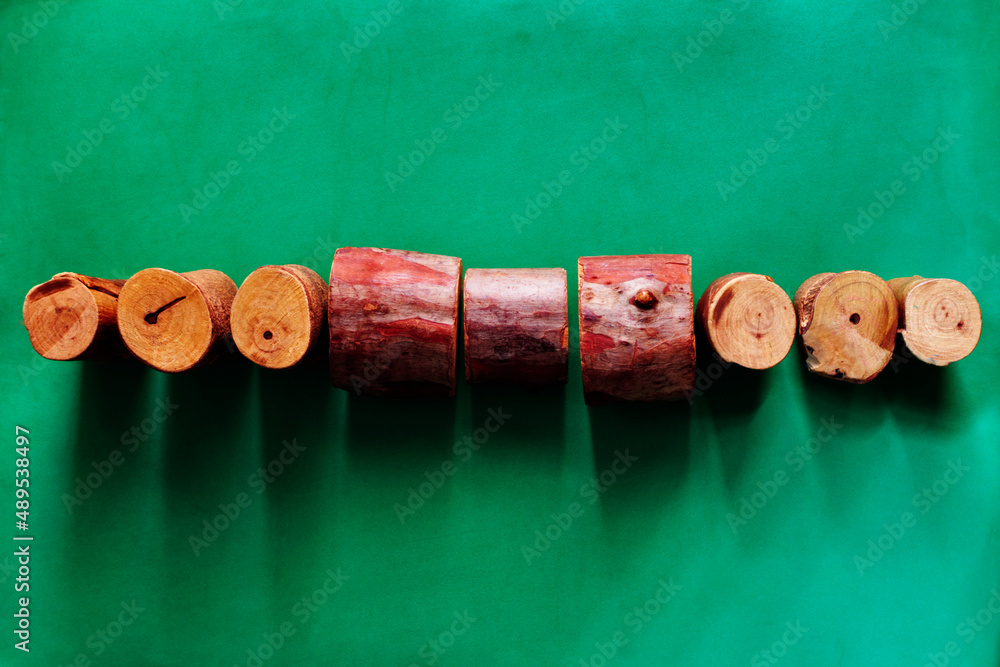 Conceptual image, with pieces of tree trunk arranged in positions that ...