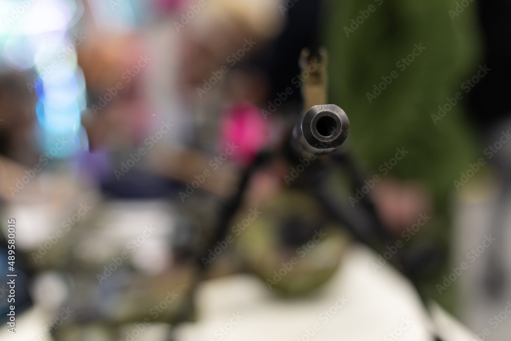 The muzzle with the sight of an army assault rifle is pointed at the ...