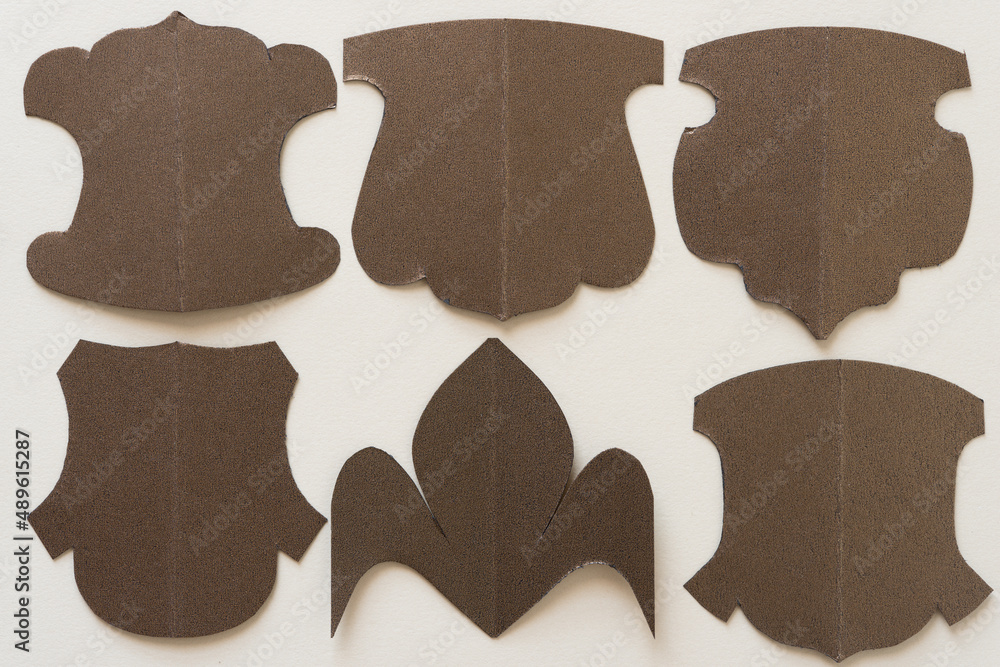 six paper shields on a paper surface Stock Photo | Adobe Stock