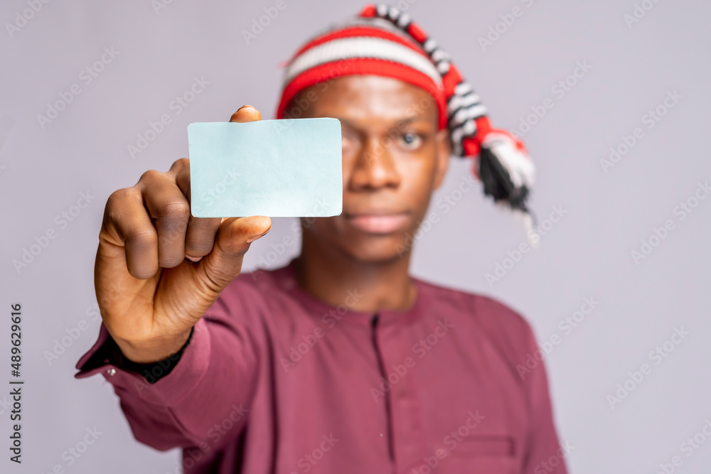 african man wearing african attire dress holding id card mock up ...