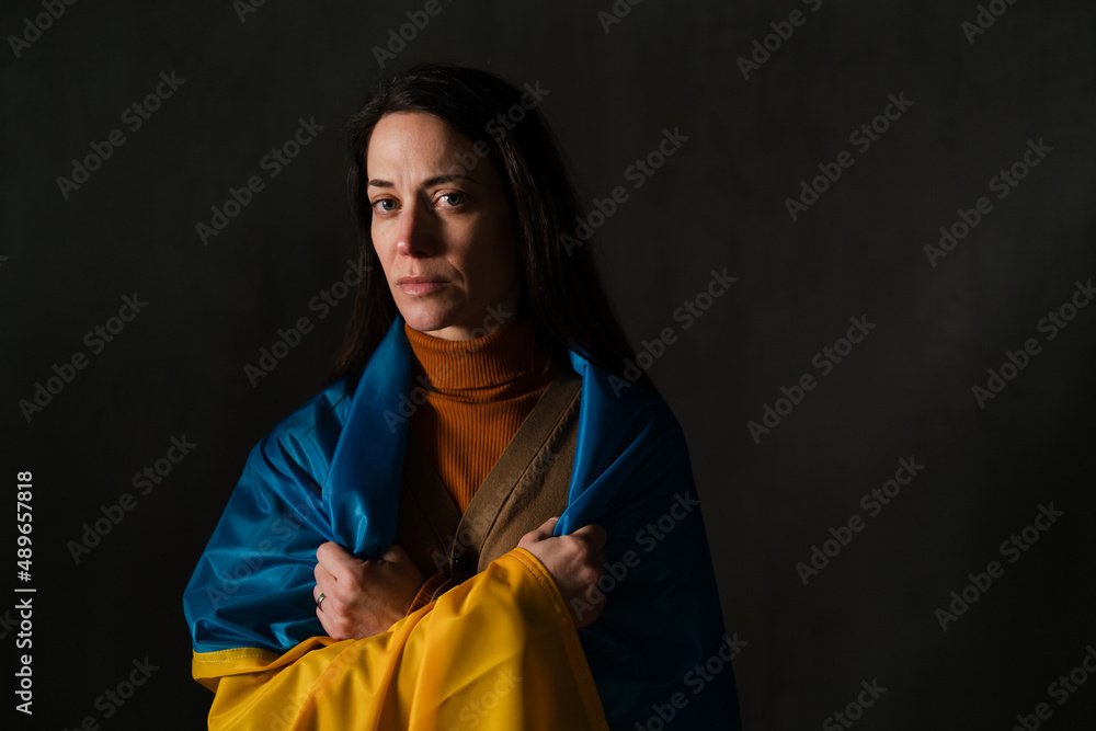 Sad woman covered with Ukraine flag. Concept of standing with Ukrainian ...