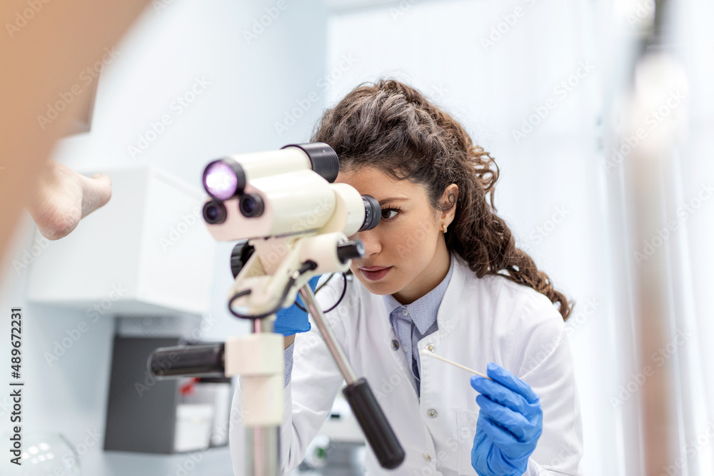 colposcope close-up, image of a gynecologist and a patient in a ...