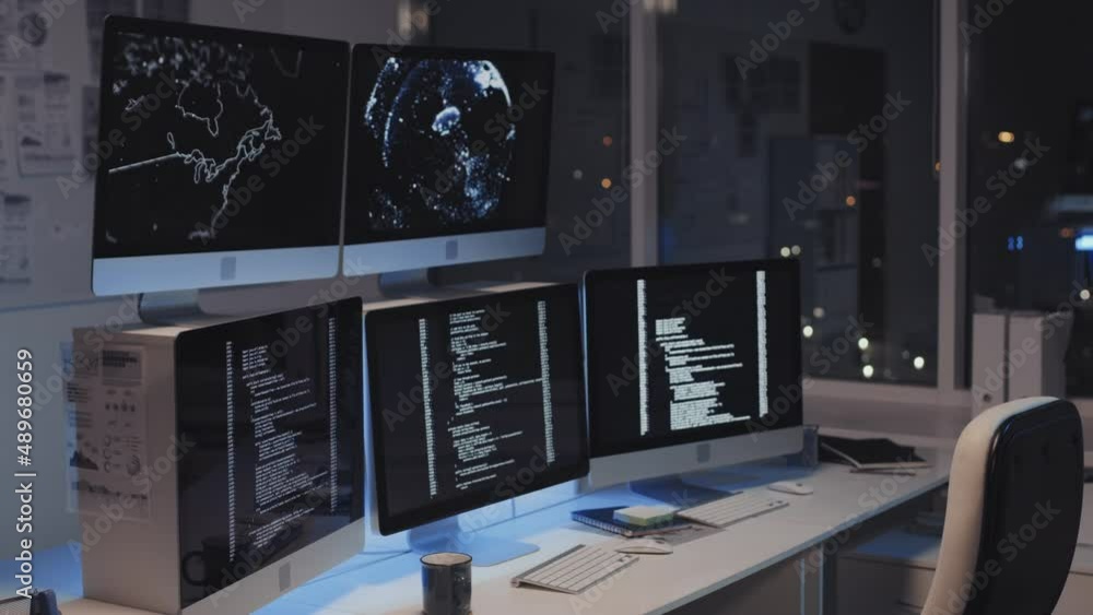 Tracking in of program with computer code running on PC, five monitors ...