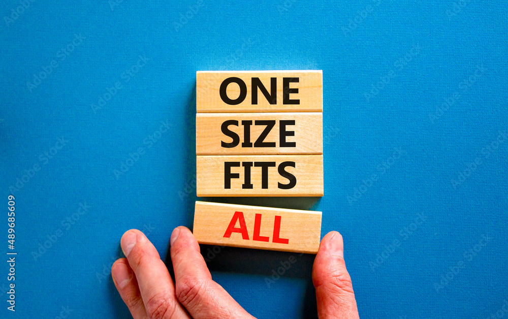 One size fits all symbol. Concept words One size fits all on wooden ...
