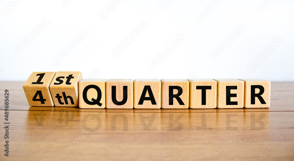 From 4th forth to 1st first quarter symbol. Turned wooden cubes and ...