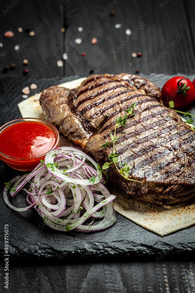 thick ribeye steak seared rare. Grilled ribeye beef steak. Dry Aged ...