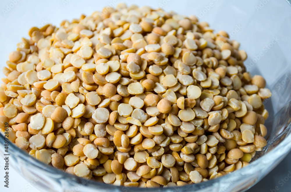 Dried natural pea grains in a glass container Stock Photo | Adobe Stock