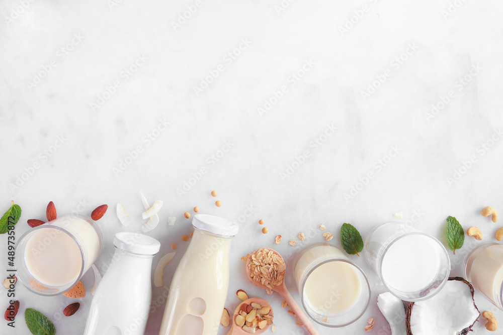 Vegan, plant based, non dairy milk bottom border. Variety of types in ...