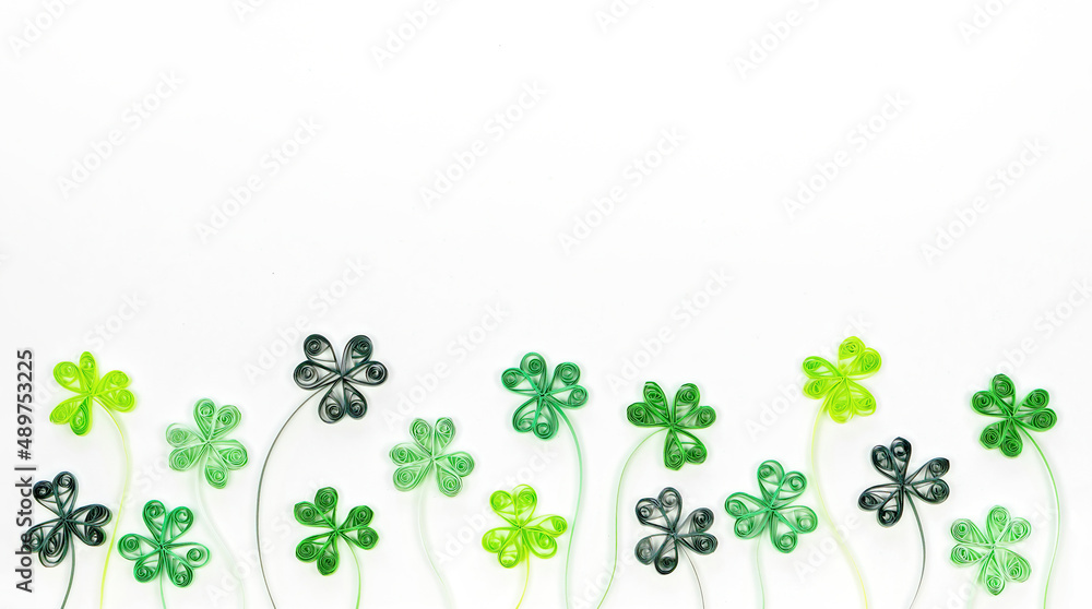 St. Patrick's Day background with shamrock and trefoil leaves made in ...