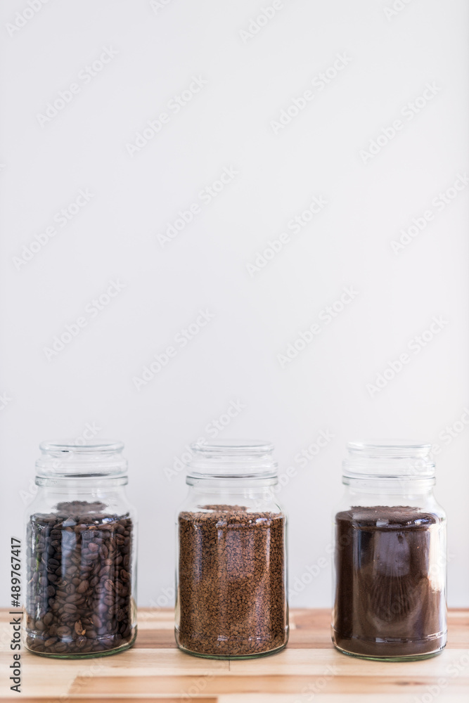 jars of coffee beans next to jar of instant coffee, best tasting option ...