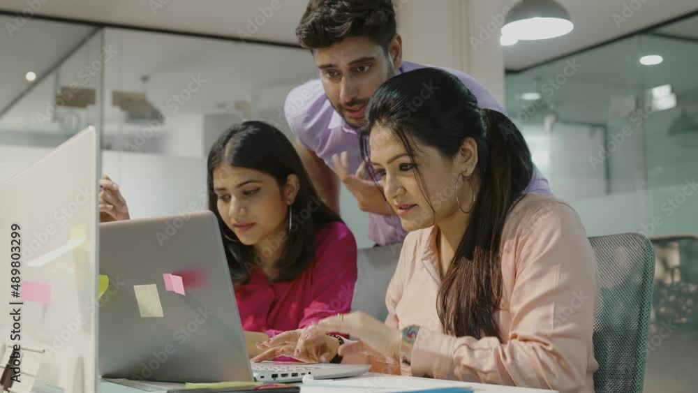 Indian team man and woman staff members gather in modern office room ...