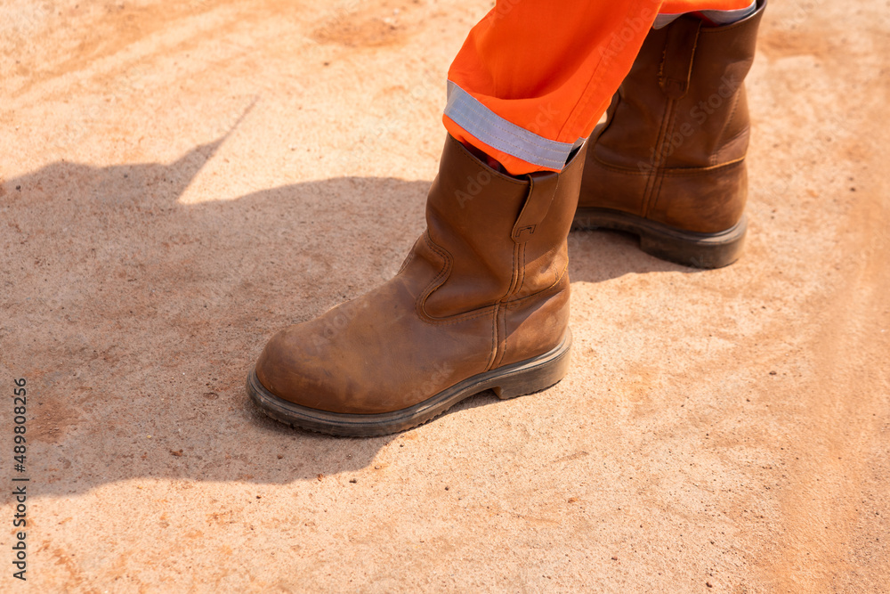 A part of operation staff which is wearied fully PPE such as leather ...