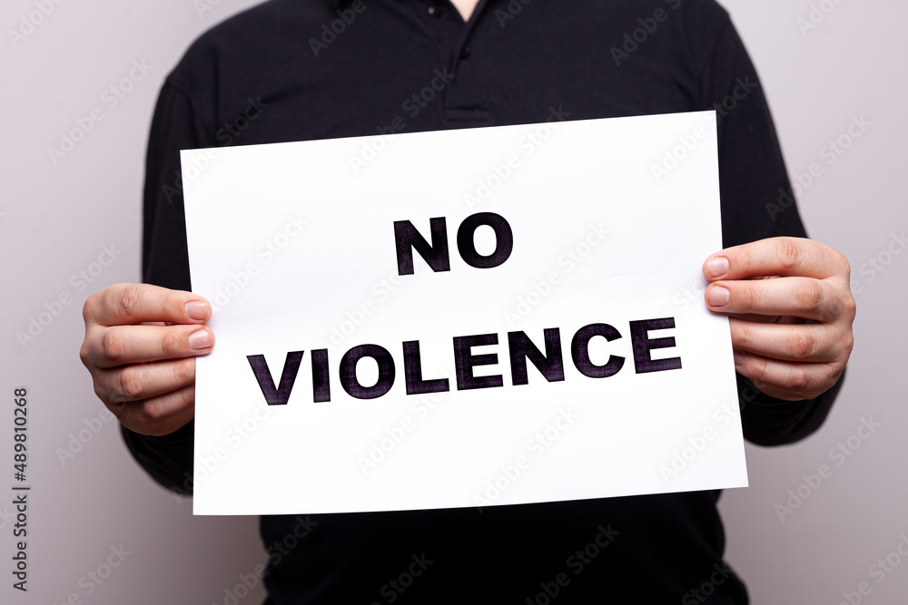 No violence. a man holds a poster in his hands with appeals, a message ...