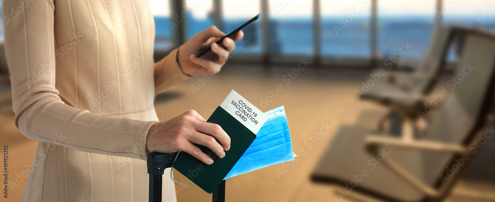 Passenger holds passport with vaccinated certificate for Covid-19 ...