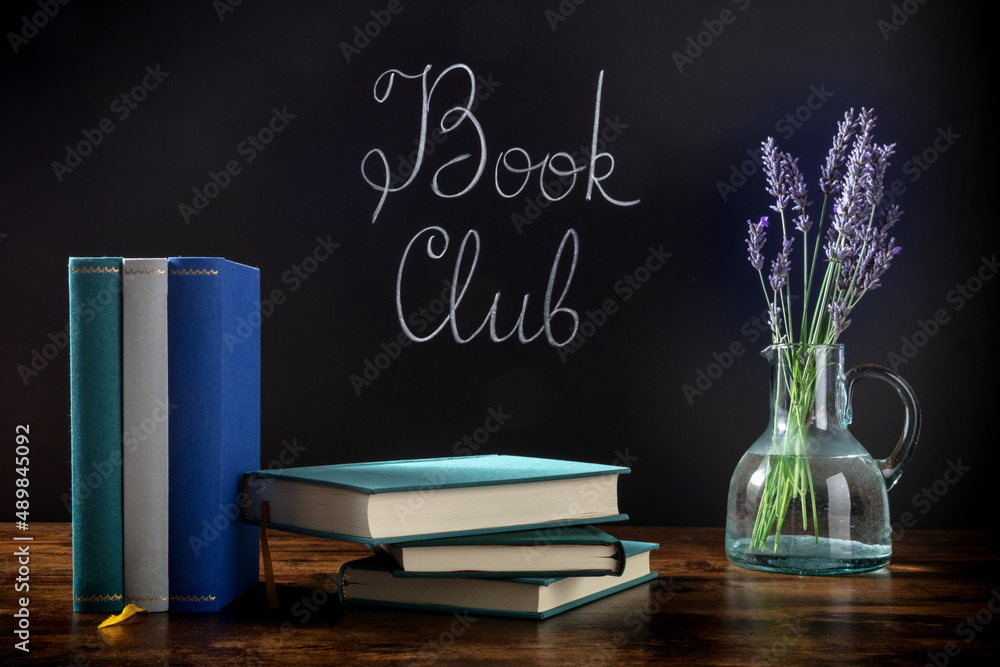 Book Club Concept. A stack of hardcover books with chalk lettering on a ...