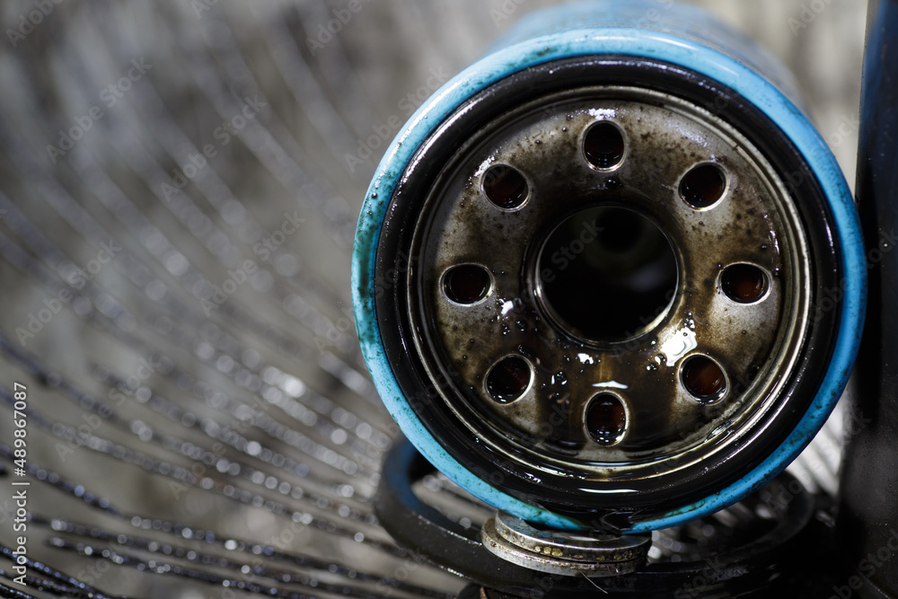 Car oil filter is very dirty and oil stains background.engine oil stain ...