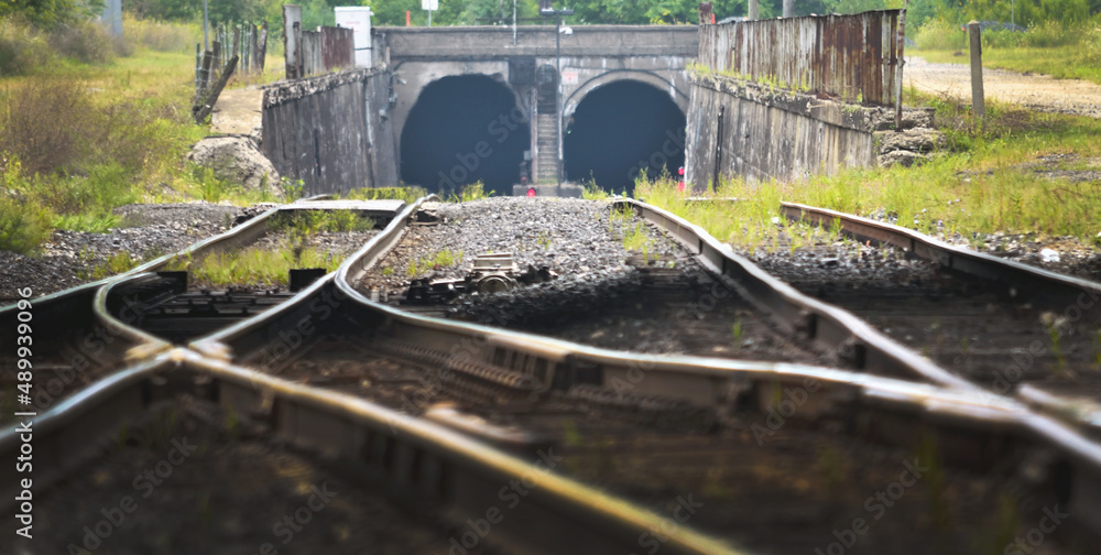 Rail tracks and two tunnels Stock Photo | Adobe Stock