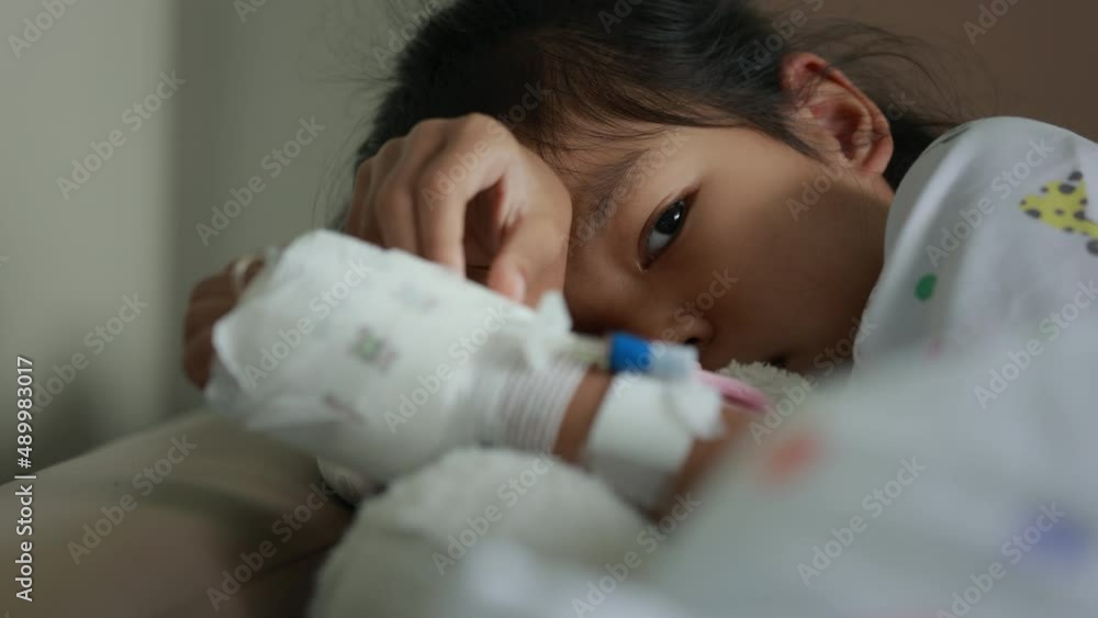 Sick asian child girl lying down on the bed at hospital Stock Video ...