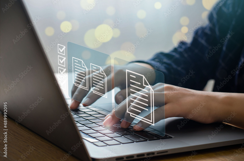 business man who uses a computer to manage documents document ...